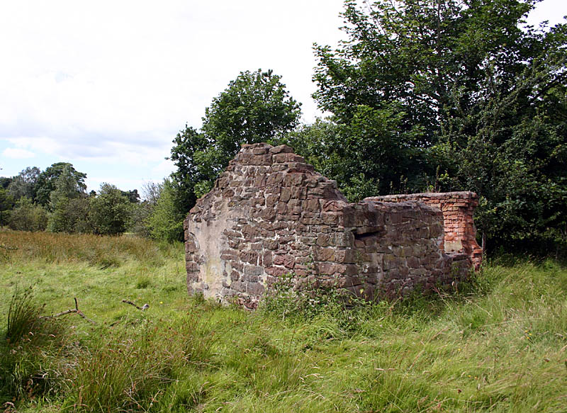 The ruined 17th century building beside the main road on the edge of ...